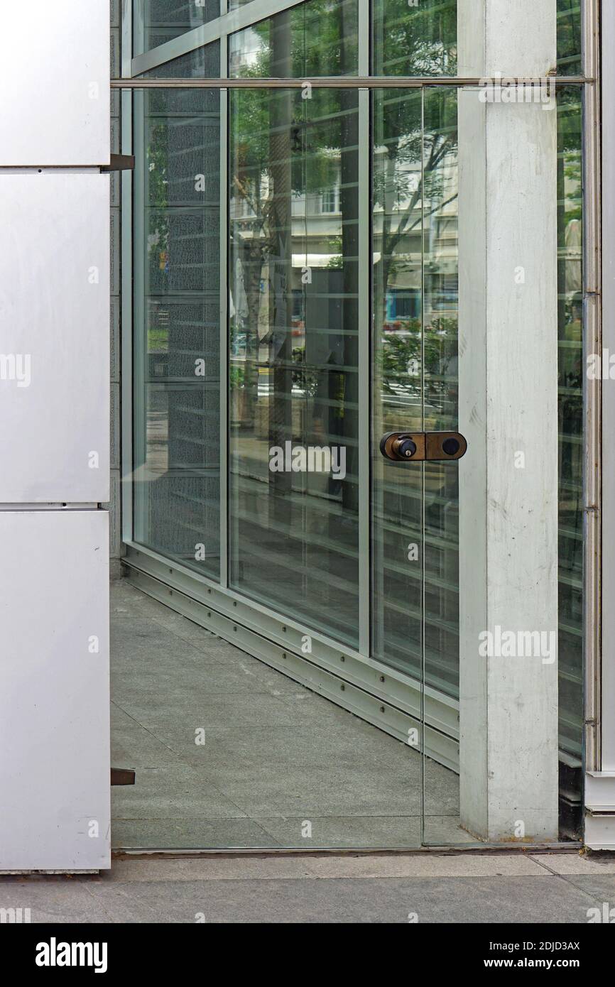 Closed clean glass door at modern building entrance Stock Photo - Alamy
