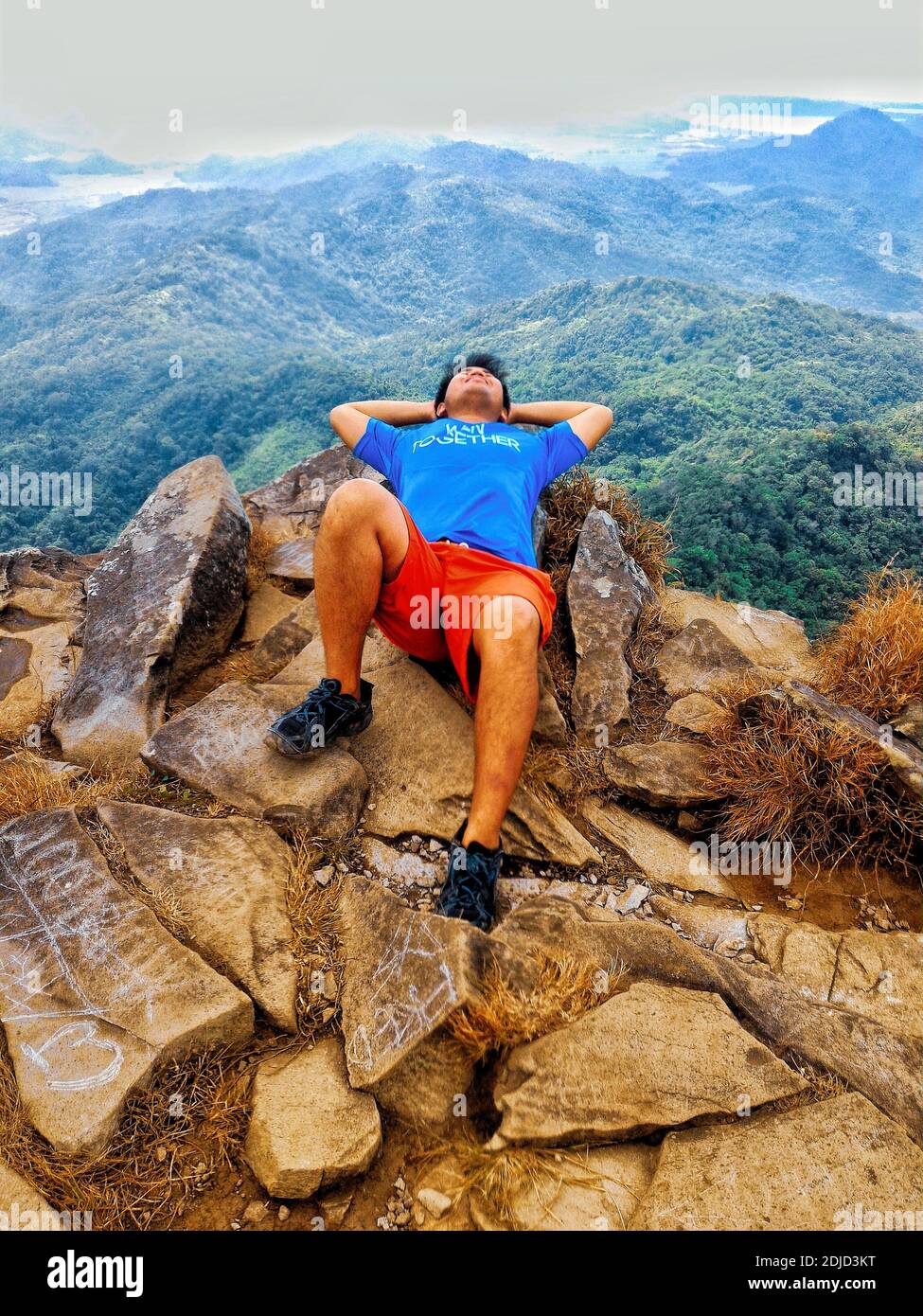 Man lying on rocks hi-res stock photography and images - Alamy