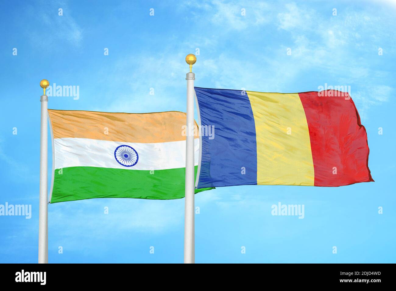India and Romania two flags on flagpoles and blue cloudy sky Stock ...