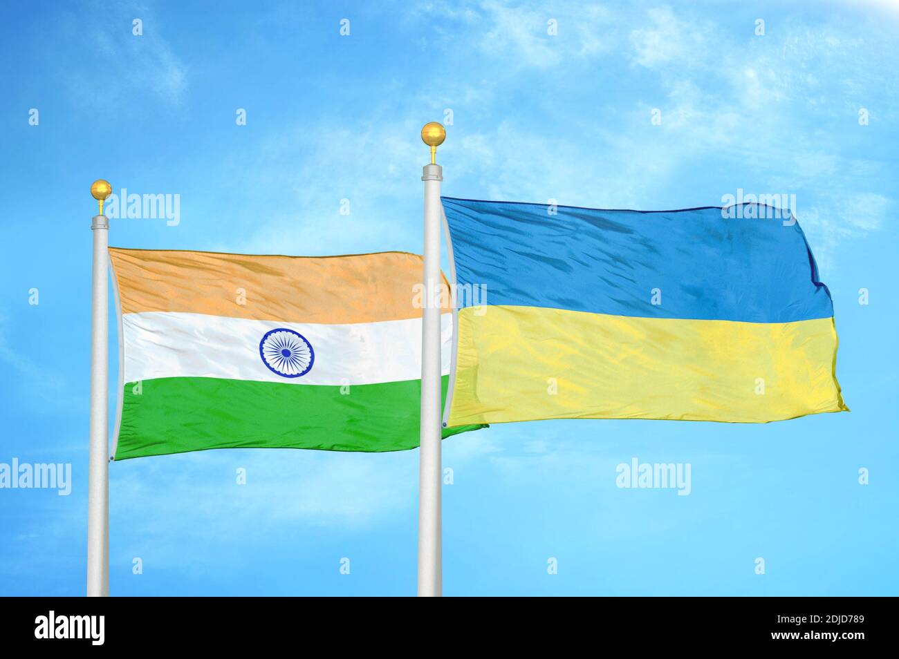 India and Ukraine two flags on flagpoles and blue cloudy sky Stock ...