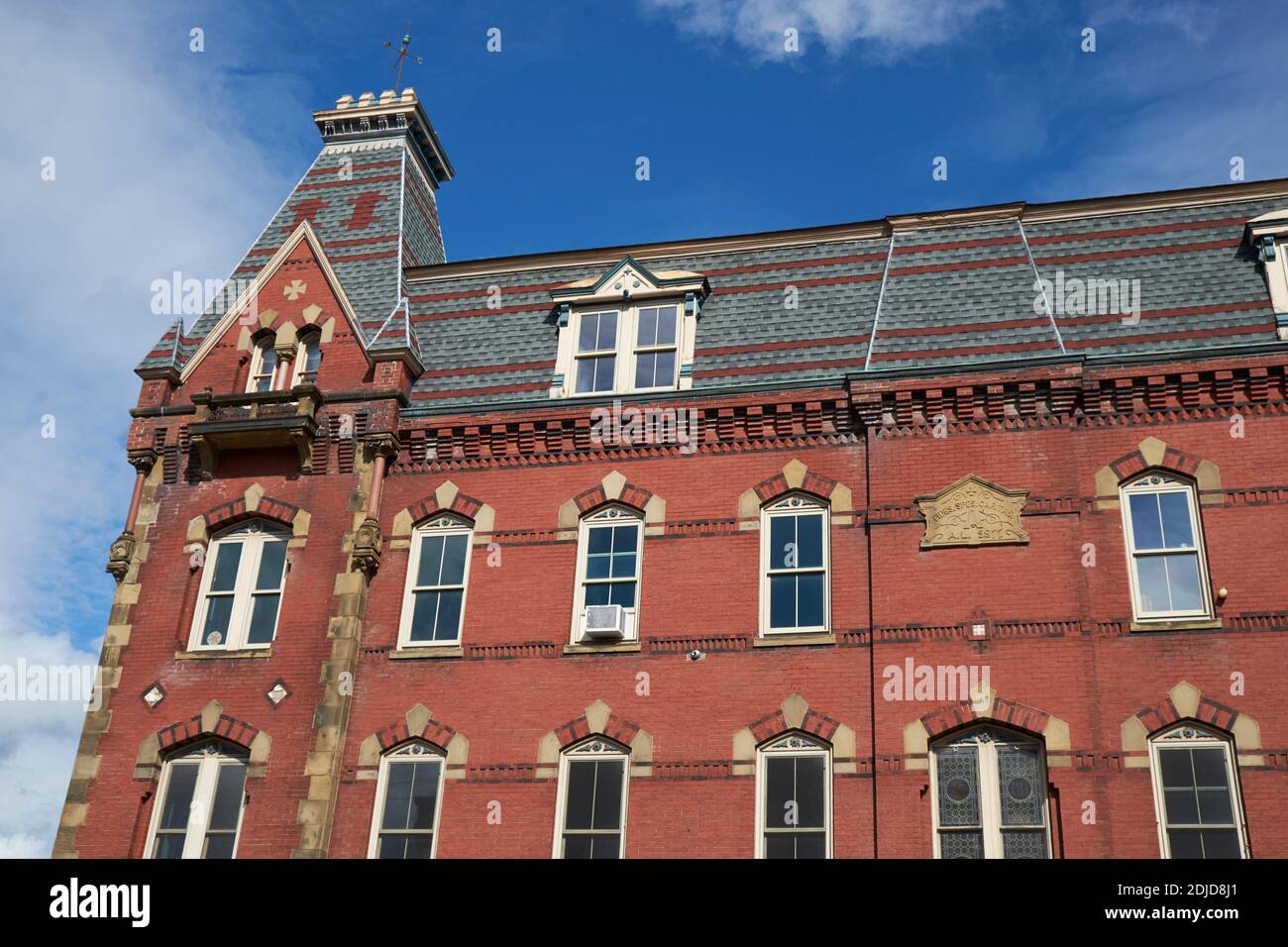 A view of the historic, landmark, large, red brick, mansard roofed ...
