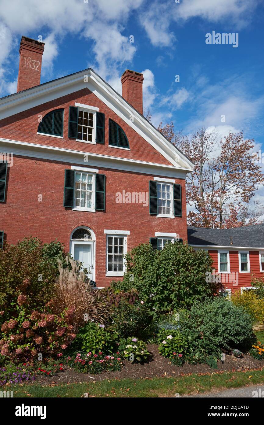 A fine example of a fancy, old, historic, red brick home and garden in ...