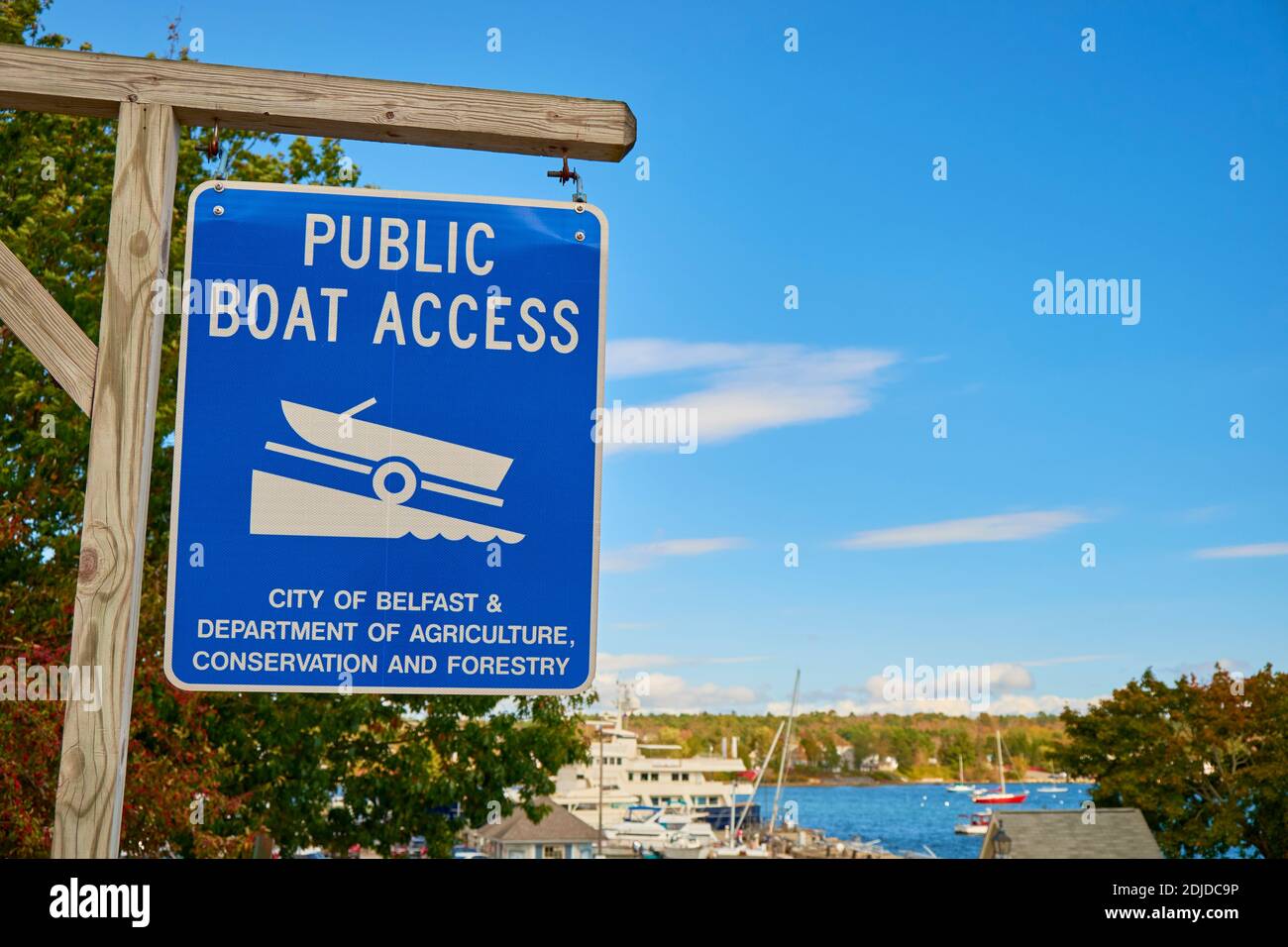 A metal blue Public Boat Access sign hangs on a wood frame at the ...