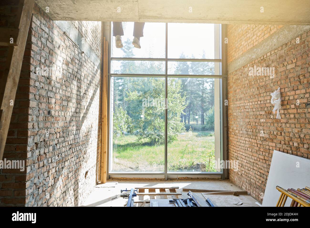 Interior view of a new house under construction on a sunny day ...
