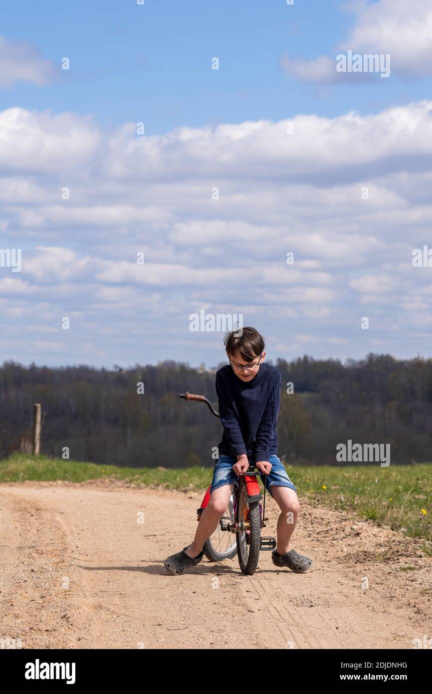 Boys cycling country road hi-res stock photography and images - Alamy