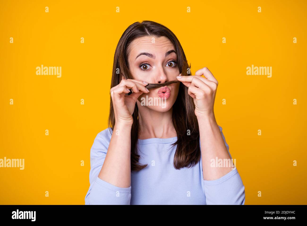 Photo of funny funky girl want joking make fake hairstyle mustache wear ...