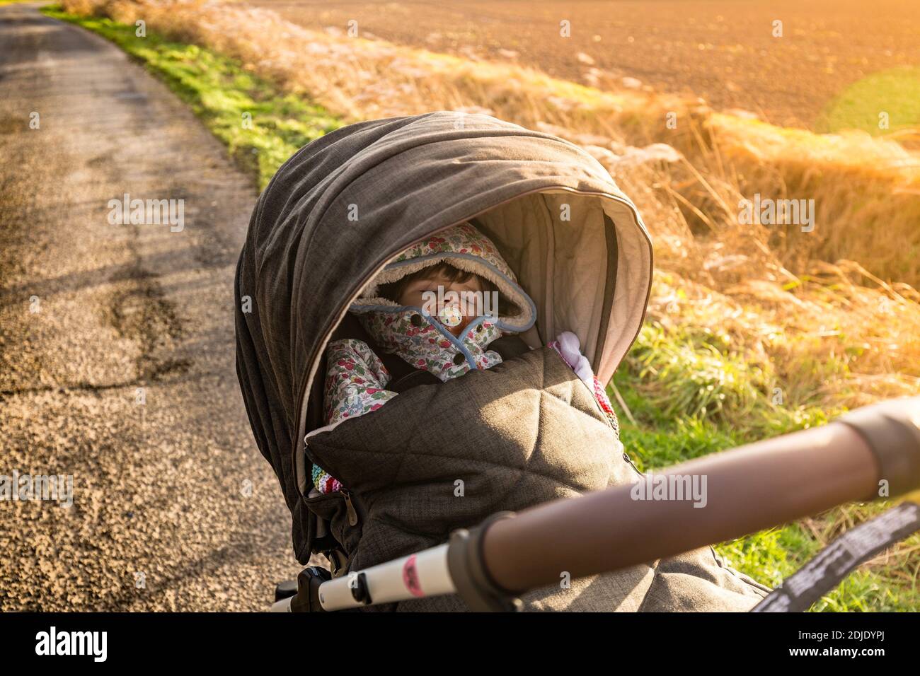 Baby sleeping on stroller in hi-res stock photography and images - Alamy