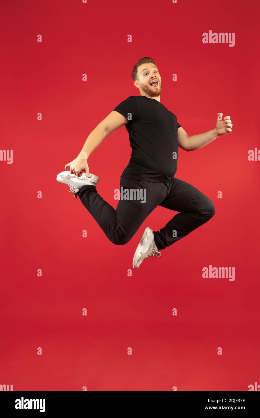 Inspired. Full length portrait of young successfull high jumping man ...