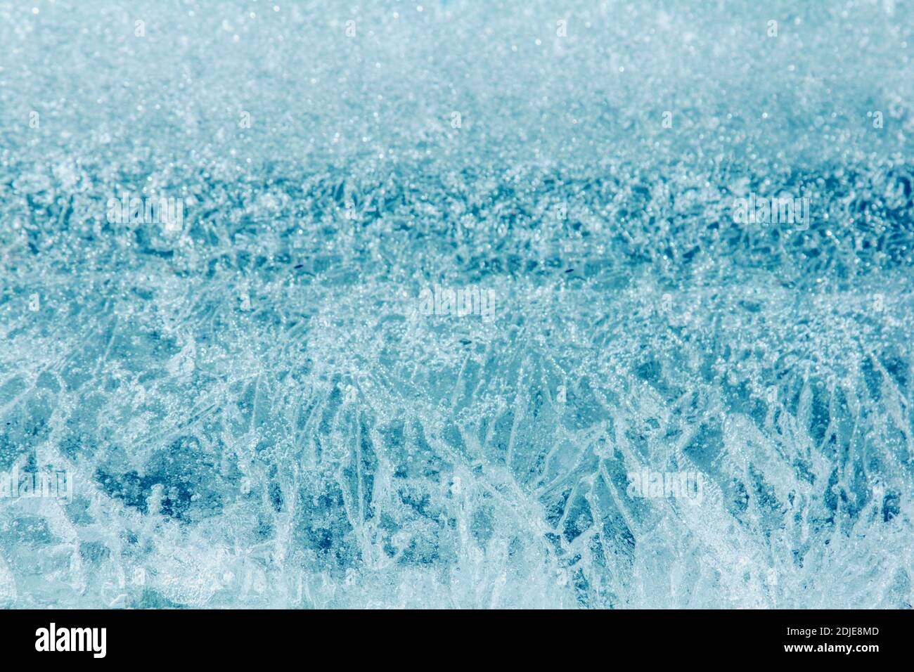 Ice frozen winter textured cold blue background Stock Photo - Alamy