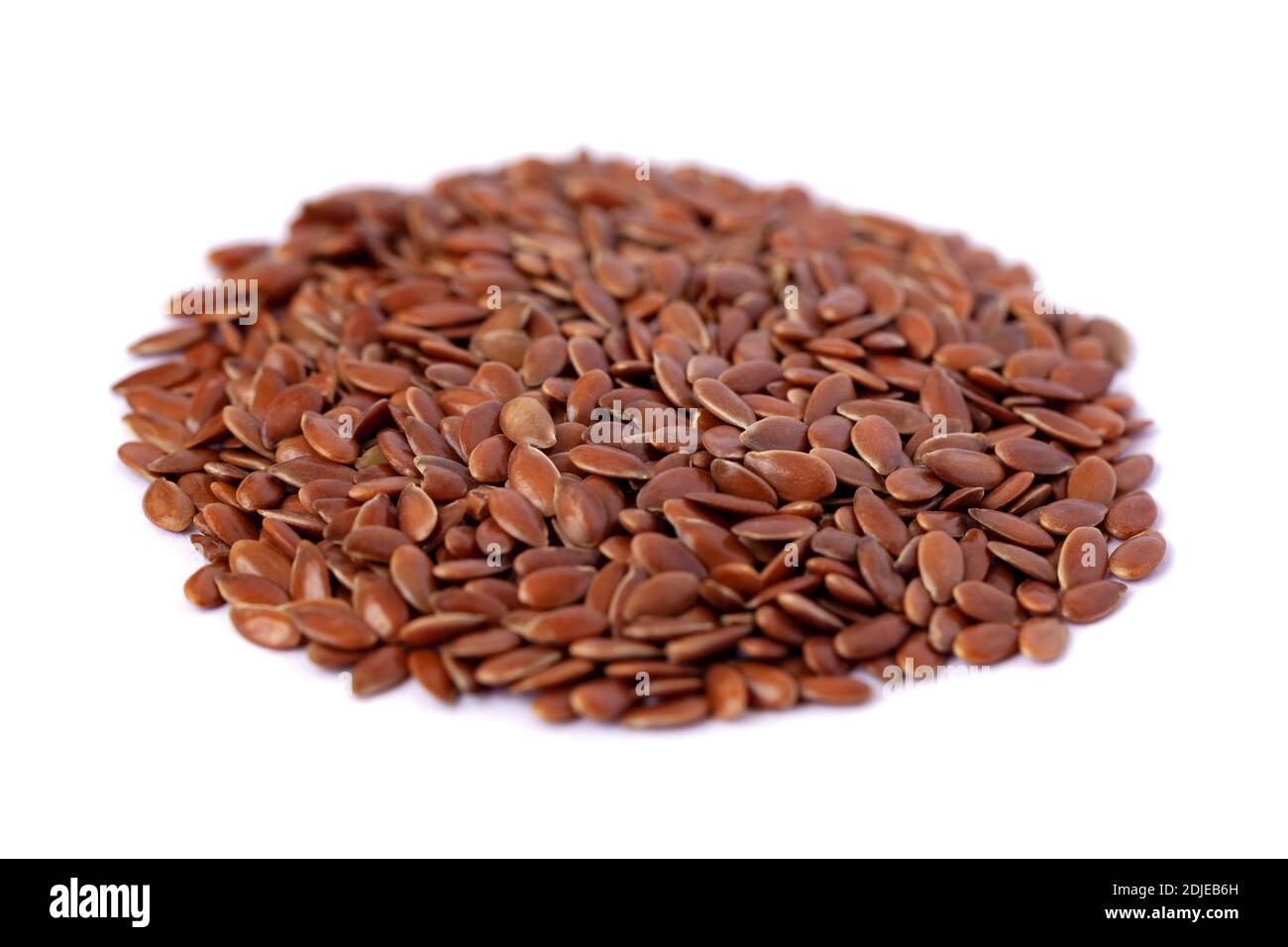 Close-up of flax seeds isolated on white background Stock Photo - Alamy