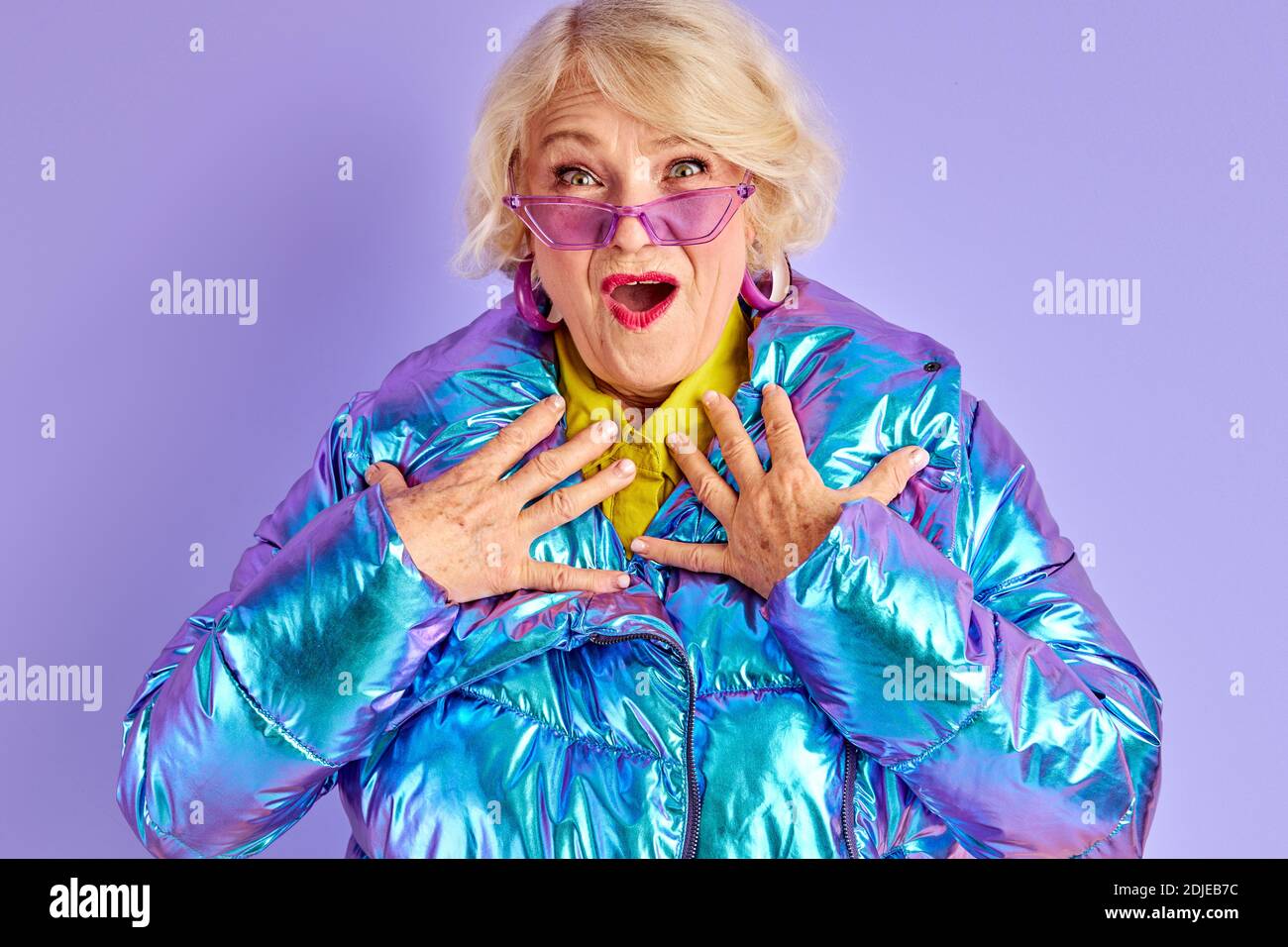 amazed surprised lady smiling, stand ins hock holding chest, with wide ...