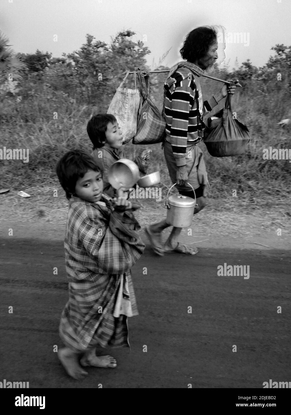 Indian people walking with bag Black and White Stock Photos & Images ...