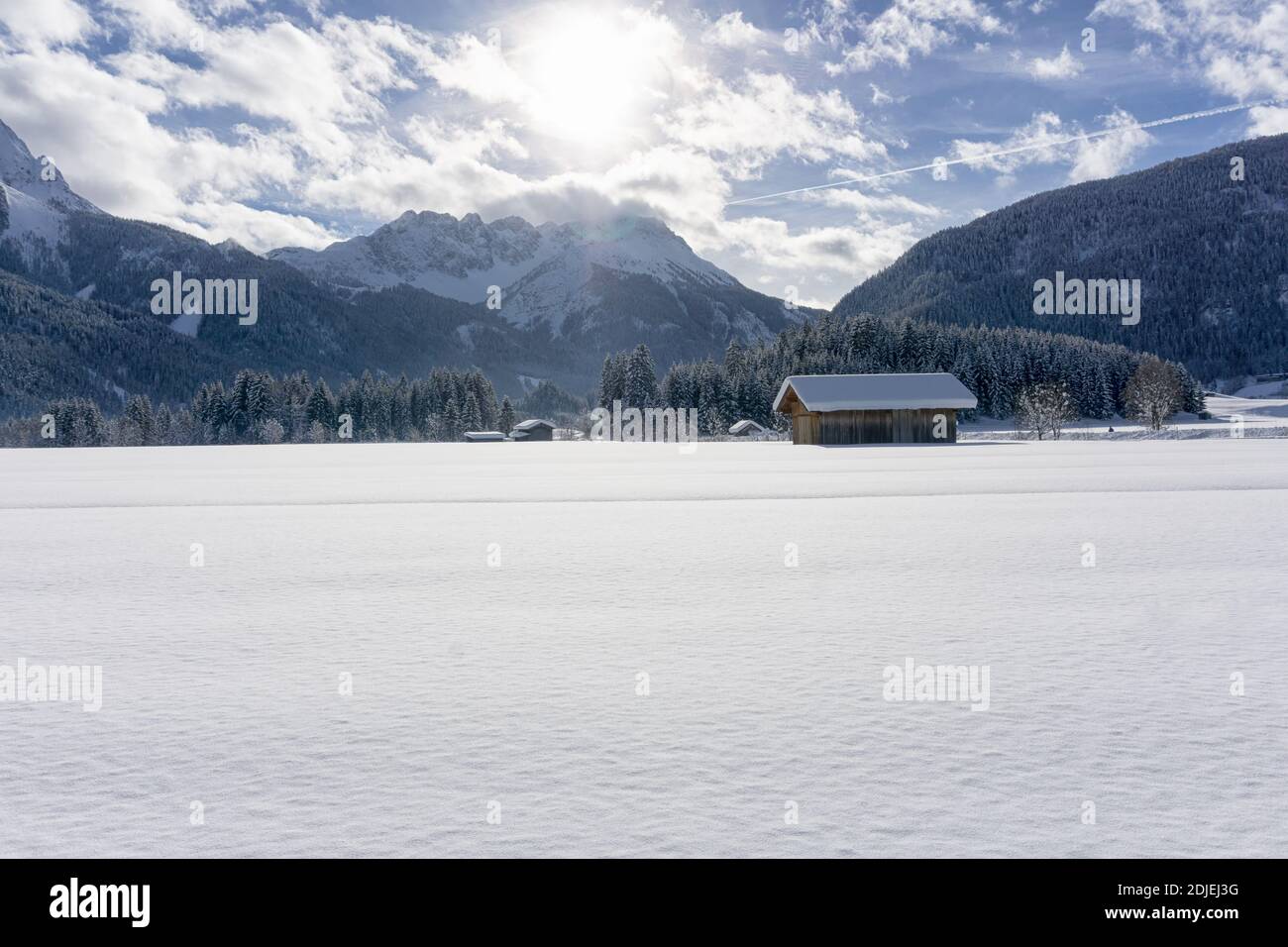 Winter mountain landscape with valley covered of fresh snow and blue ...
