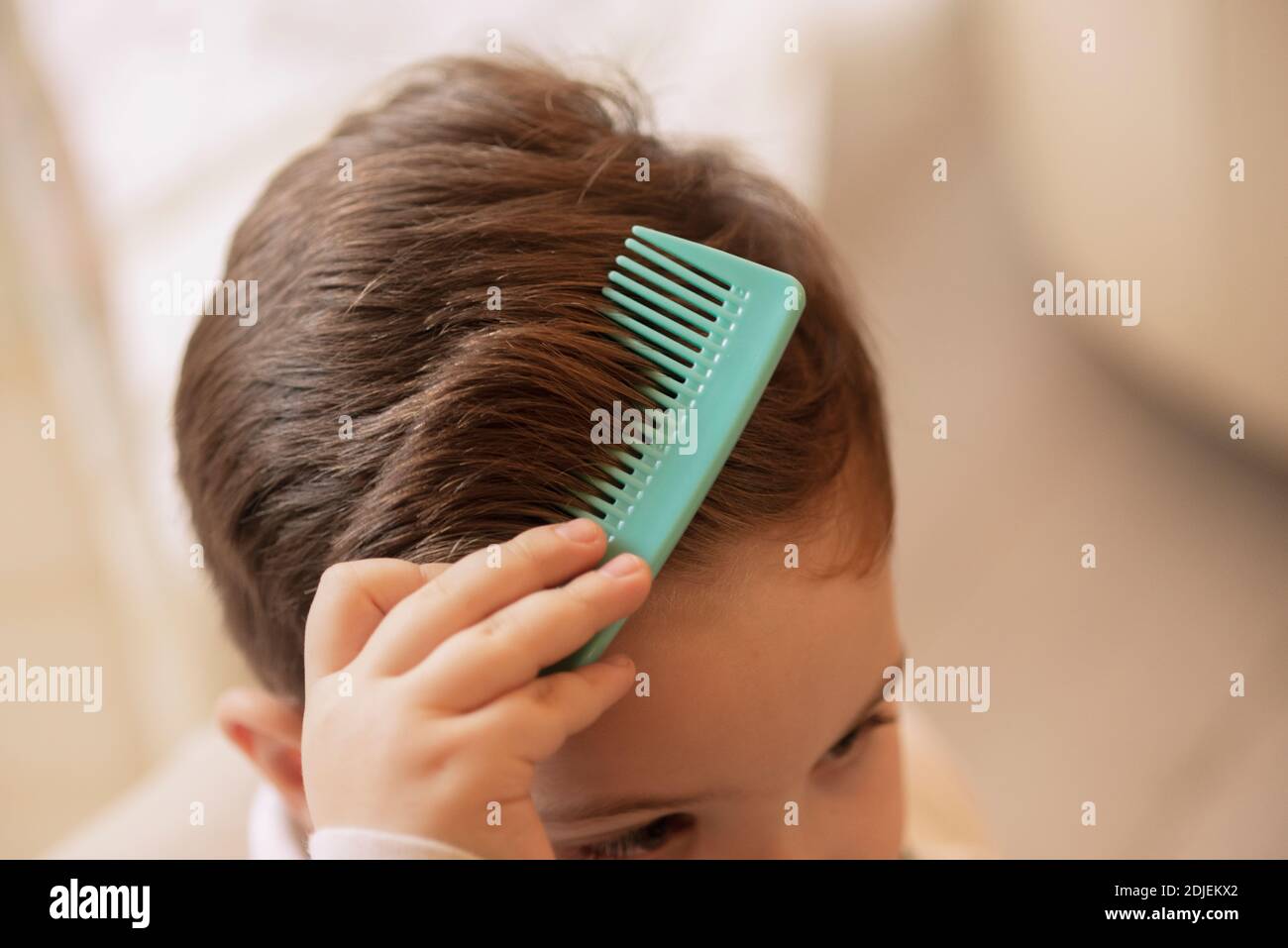 Boy combing hair hi-res stock photography and images - Alamy
