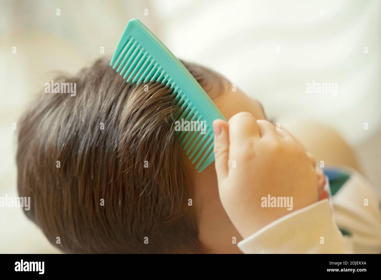 Little Boy Combing His Hair Stock Photo - Alamy