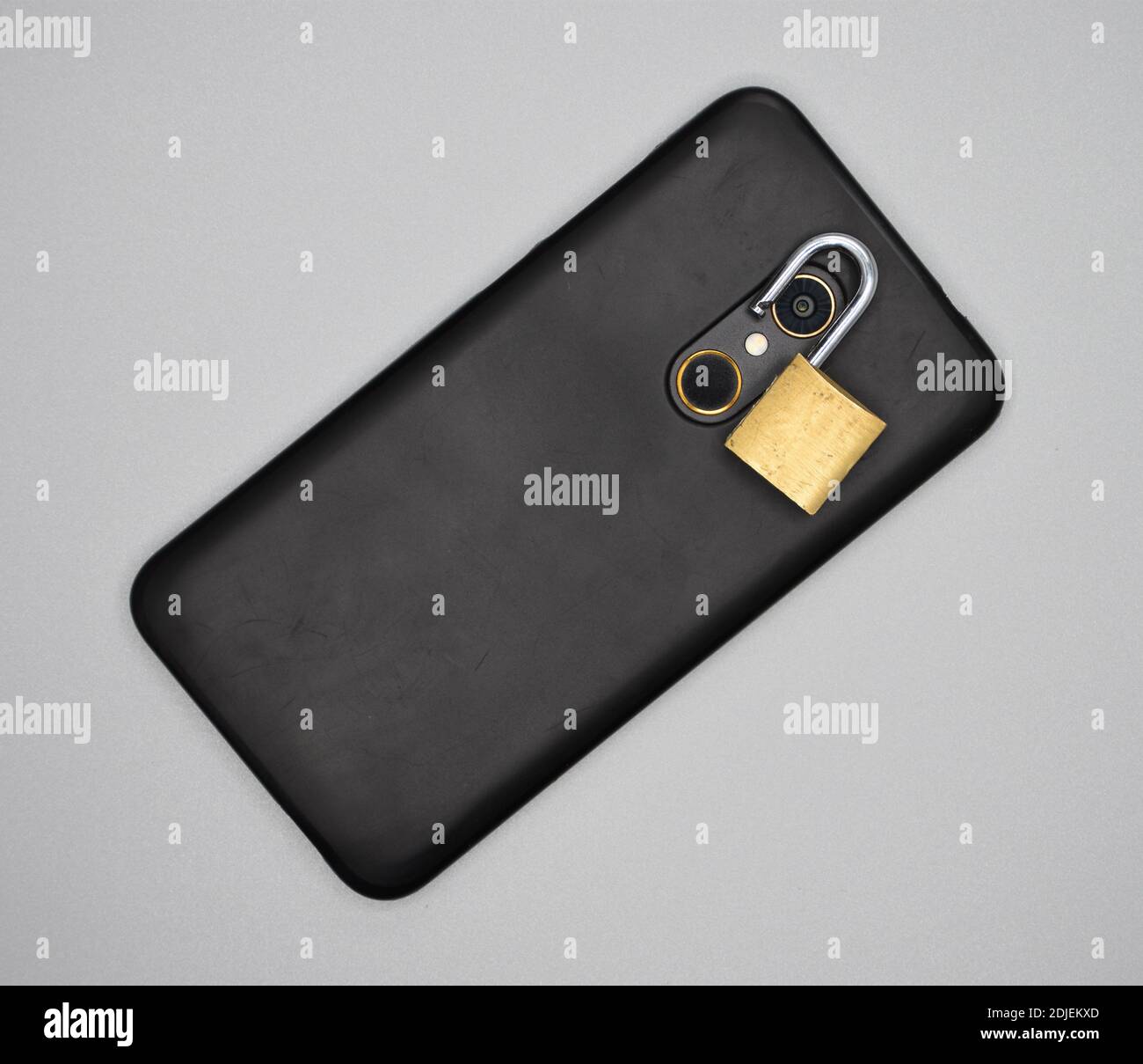 Mobile with open padlock around the photo camera, computer insecurity ...