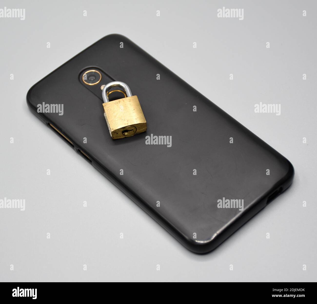 Mobile phone with a closed padlock on top of the camera Stock Photo - Alamy