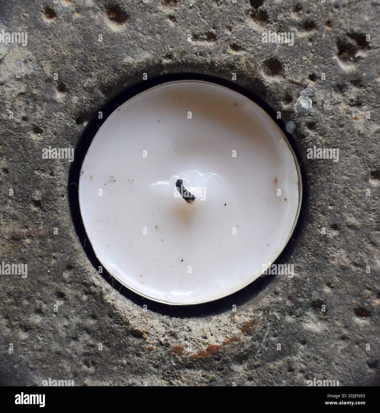 White candle in porous rock hole. Logroño, La Rioja Stock Photo - Alamy