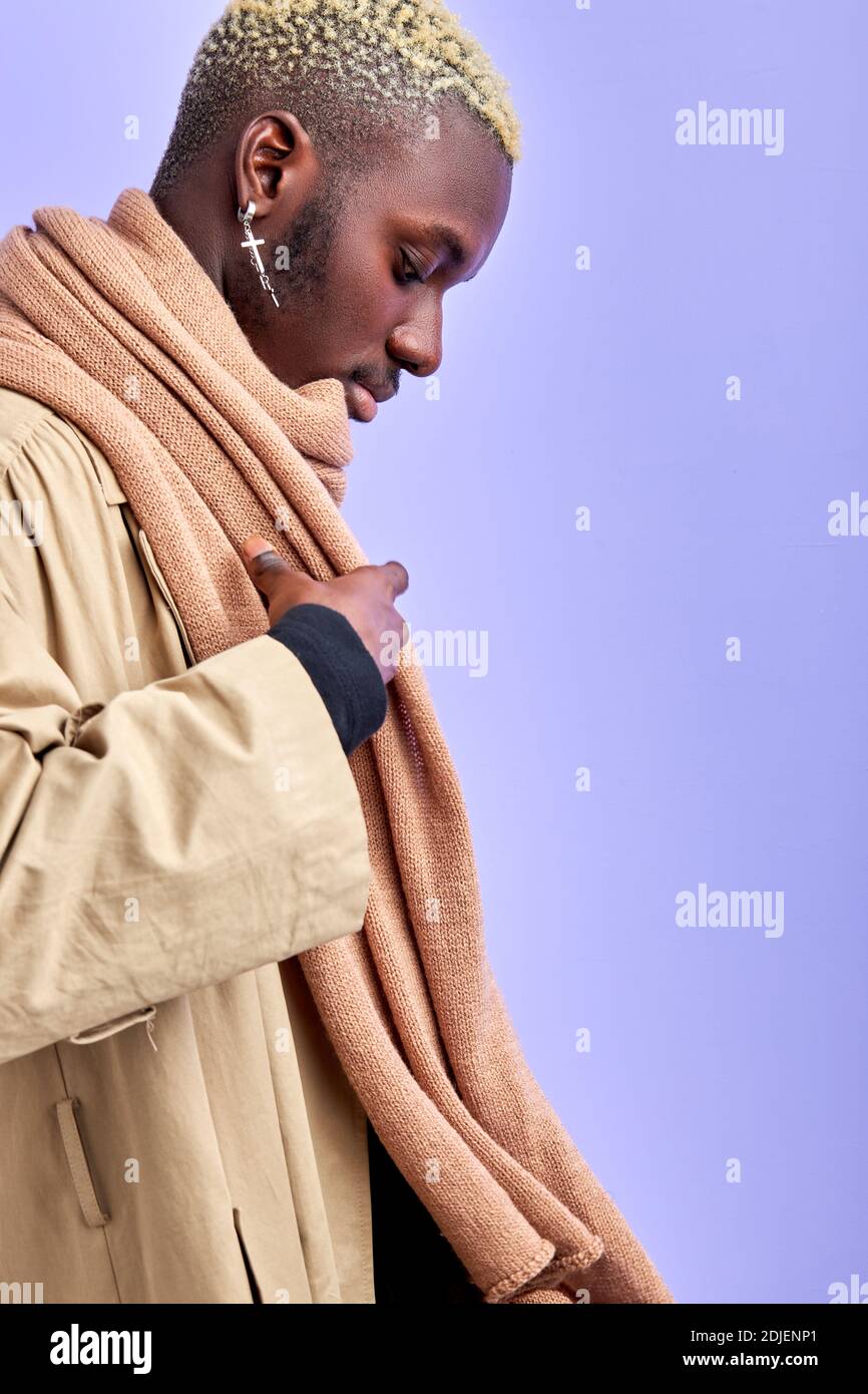 side view on afro american male wearing scarf and coat isolated over ...