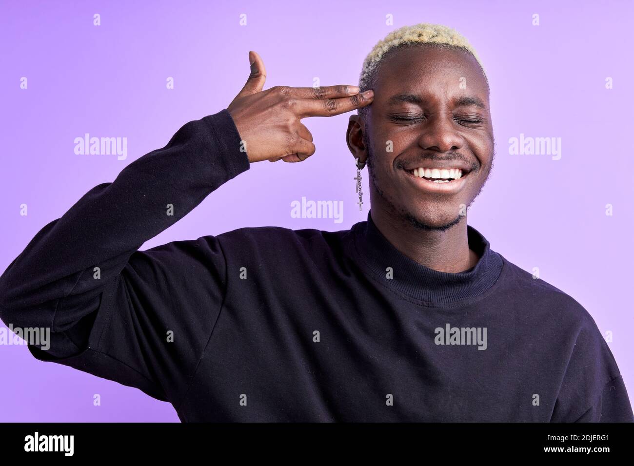 fancy male pretends to shoot himself, pleased fancy african american ...