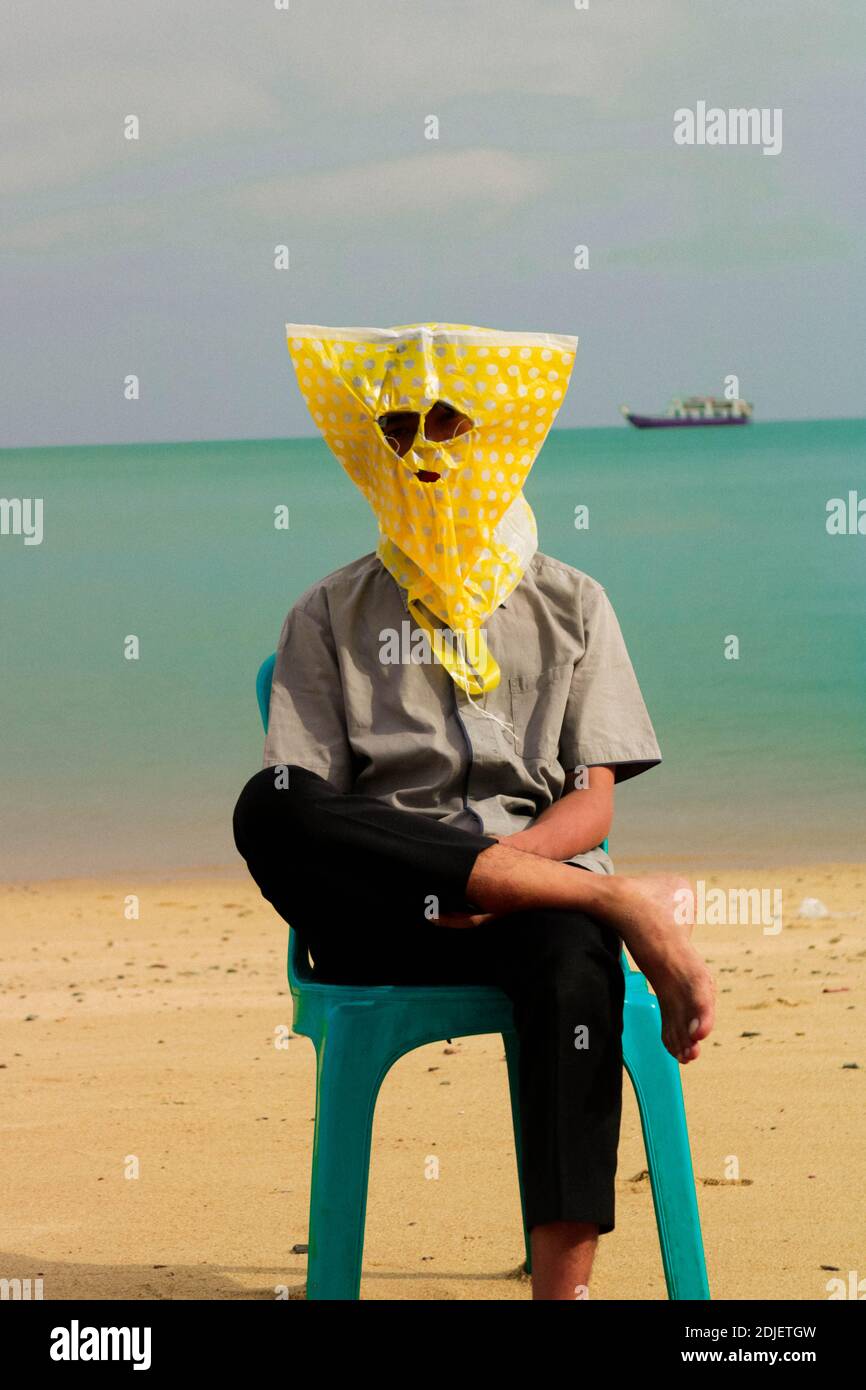 Man sitting on plastic chair hi-res stock photography and images - Alamy