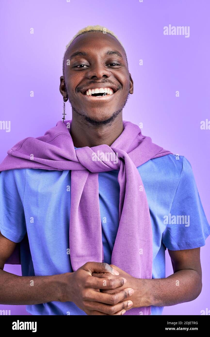 positive black male in casual shirt posing at camera, smiling, having ...