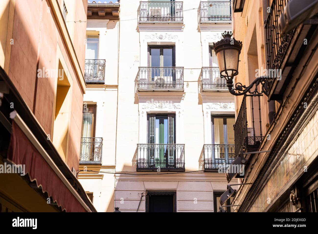 Old historic houses with windows, balconies and streetlight in Madrid ...