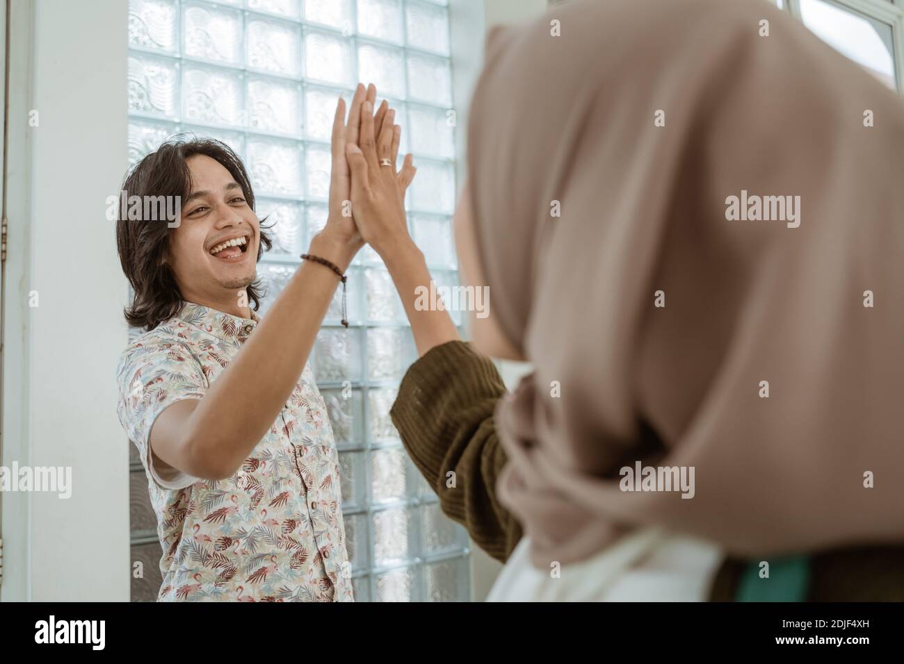 Portrait happy student on campus. Hurray we did it high five Stock ...
