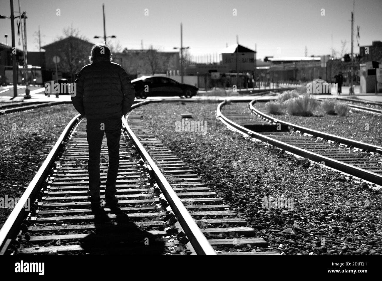 A lone man walks along railroad tracks running through Santa Fe, New Mexico Stock Photo - Alamy