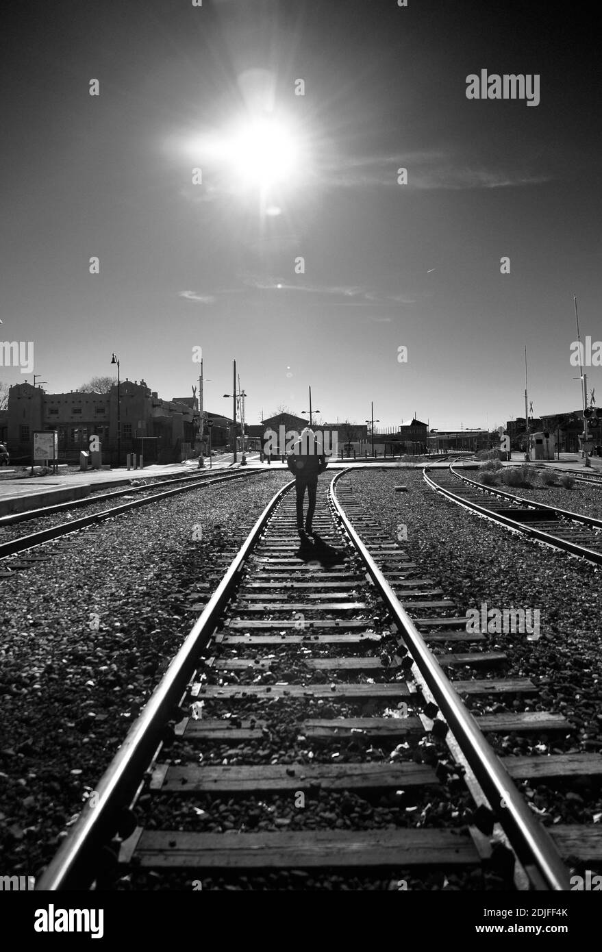 Man walking along train tracks hi-res stock photography and images - Alamy