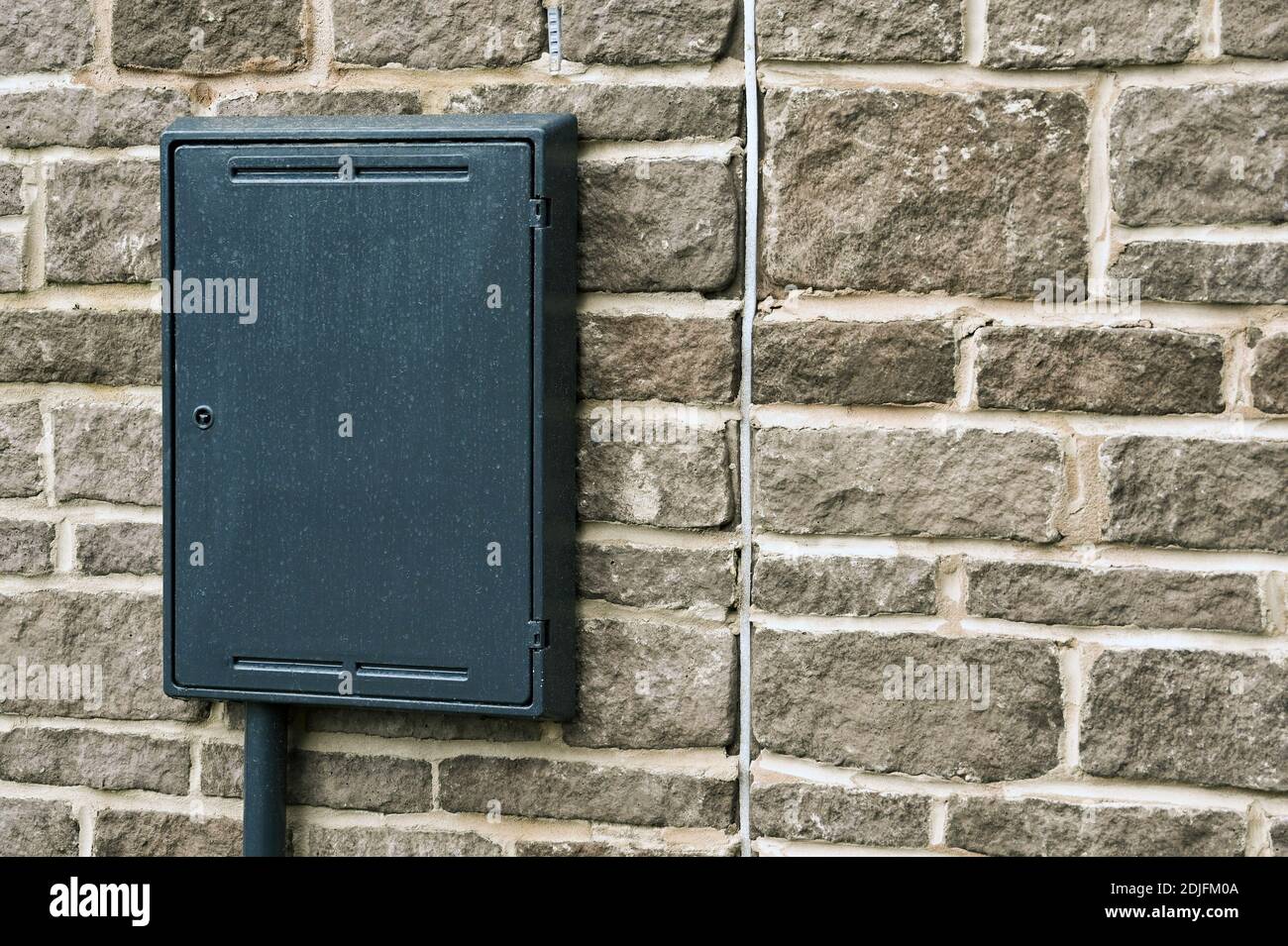 Plastic box for electricity and gas meters on the side of a new house ...