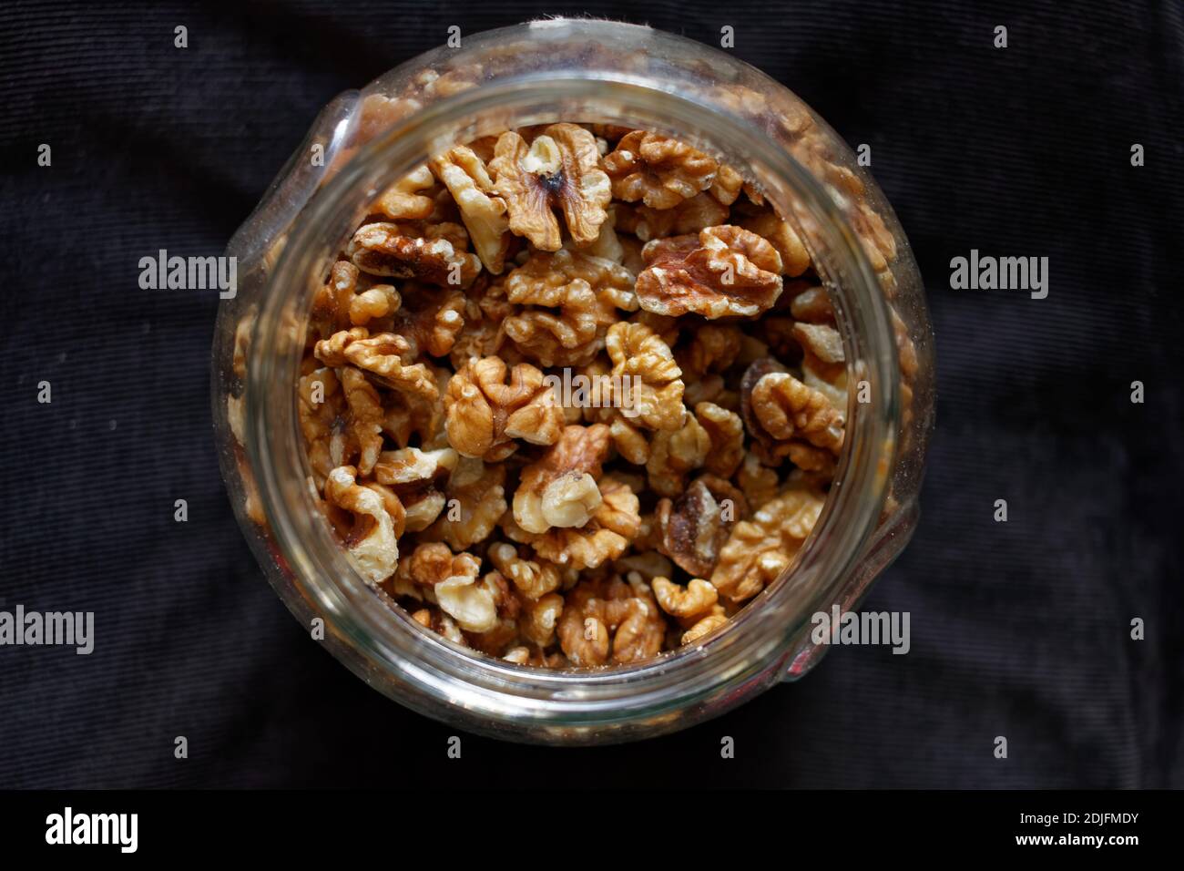 Walnuts in a big glass jar Stock Photo - Alamy