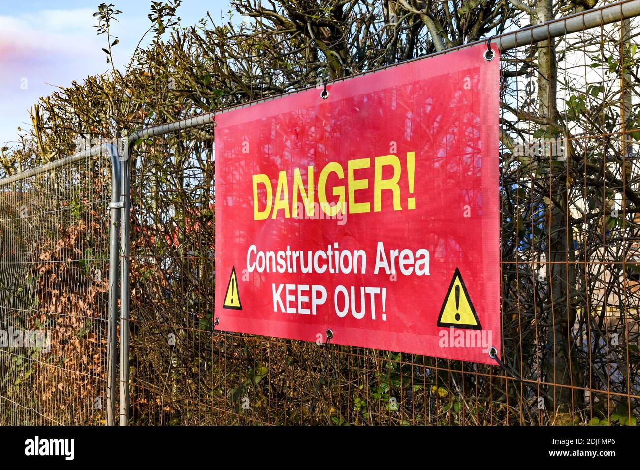 Danger Keep Out sign on a metal fence around a construction site Stock ...
