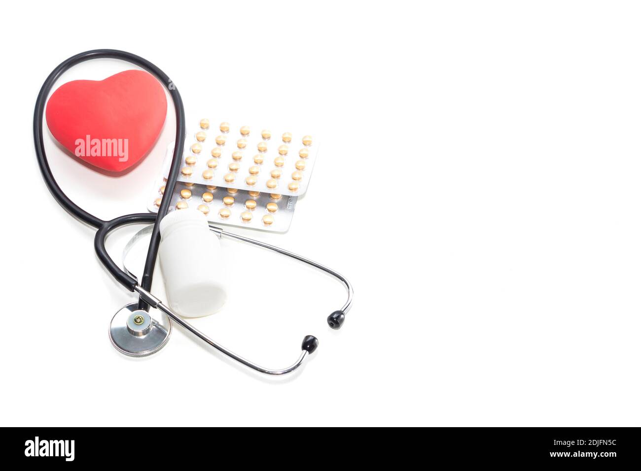 Red heart on the background of pills. Concept of health, heart disease ...