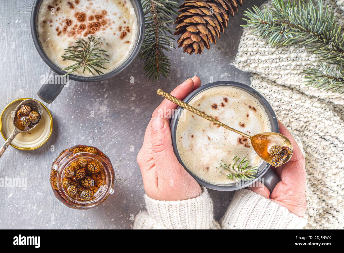 Coffee latte with pine needles and pine cone jam, trendy organic winter ...