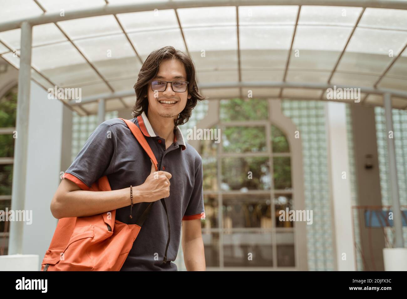 Portrait young smilling student hi-res stock photography and images - Alamy