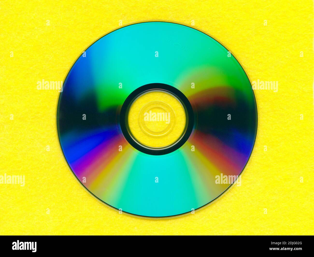 compact disk on a yellow background Stock Photo - Alamy