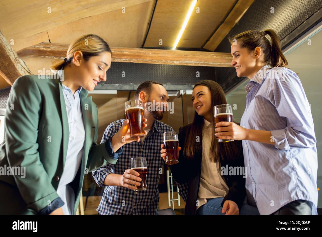 Joy. Happy co-workers celebrating corporate event after tensioned work ...