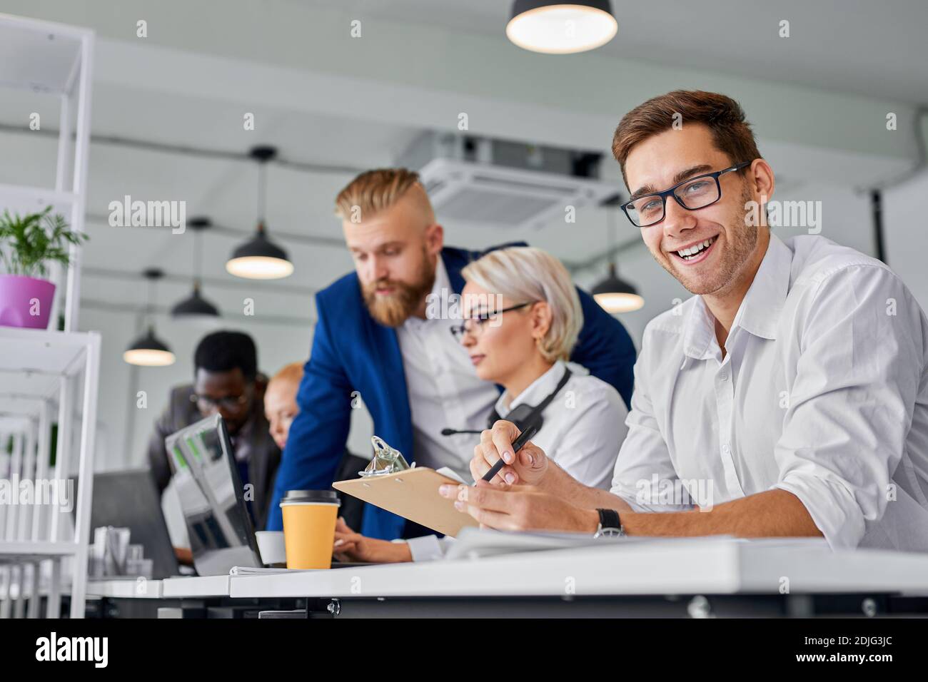 male director give directions to employees in the office, young team ...