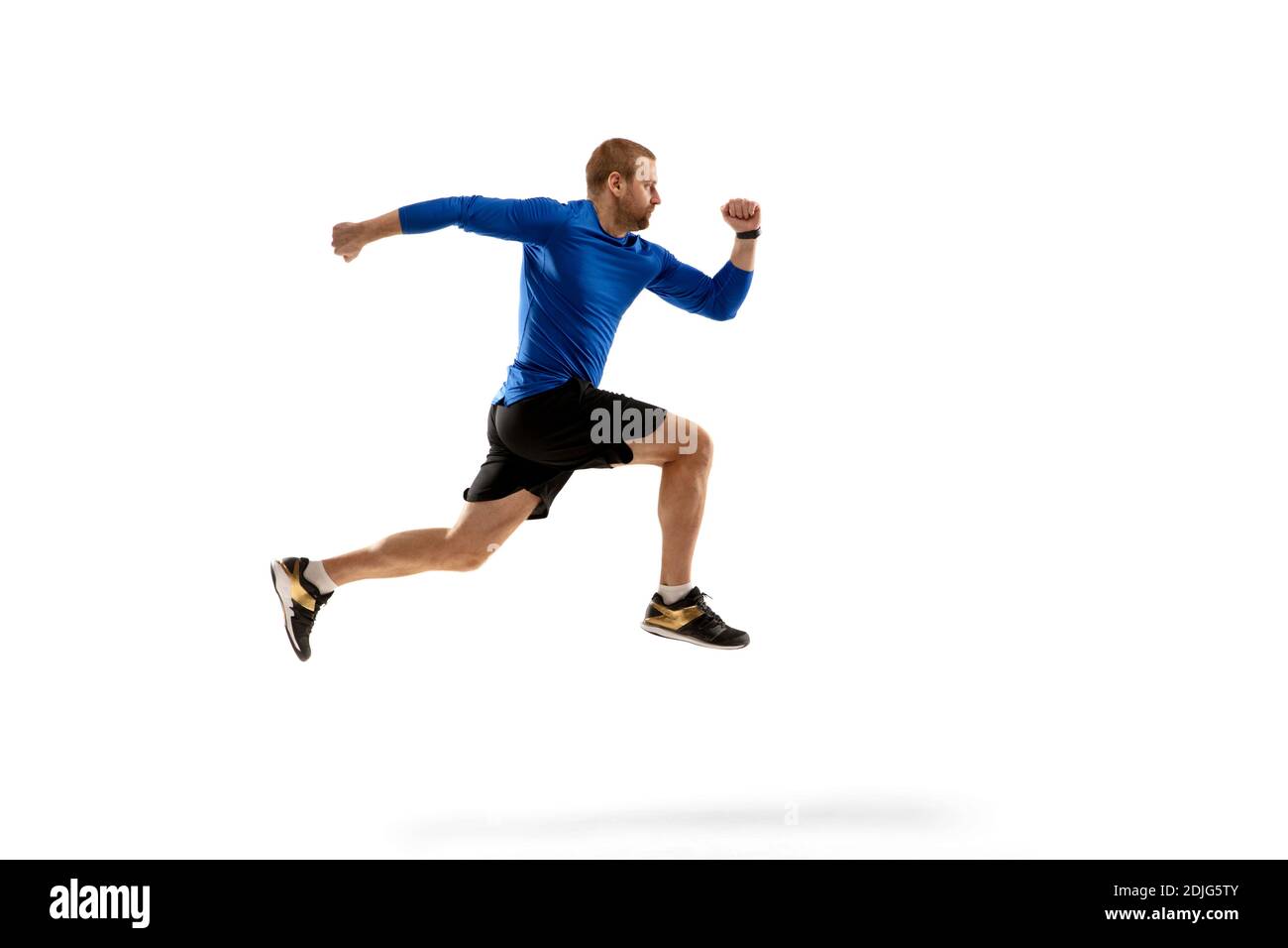 Win. Caucasian professional jogger, runner training isolated on white ...