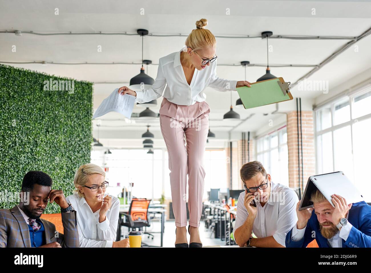 rude angry female boss executive is dissatisfied irritated by employees ...