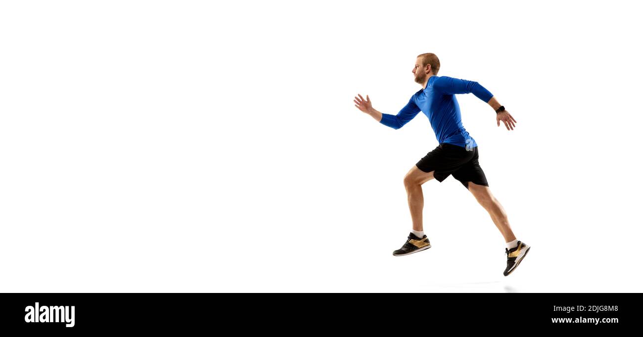 Flyer. Caucasian professional jogger, runner training isolated on white ...