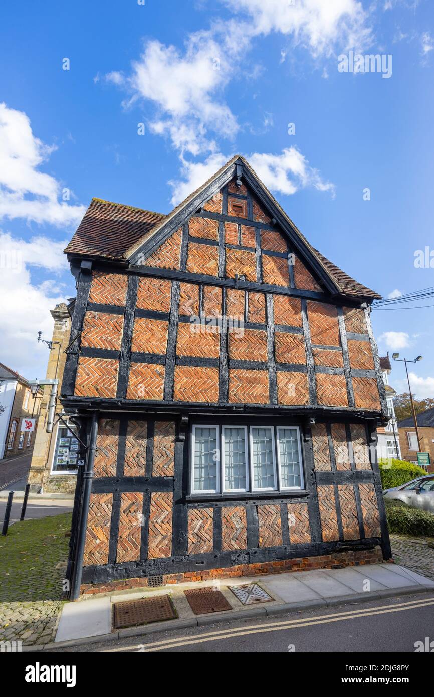 The timbered side wall elevation and brickwork of a building forming ...