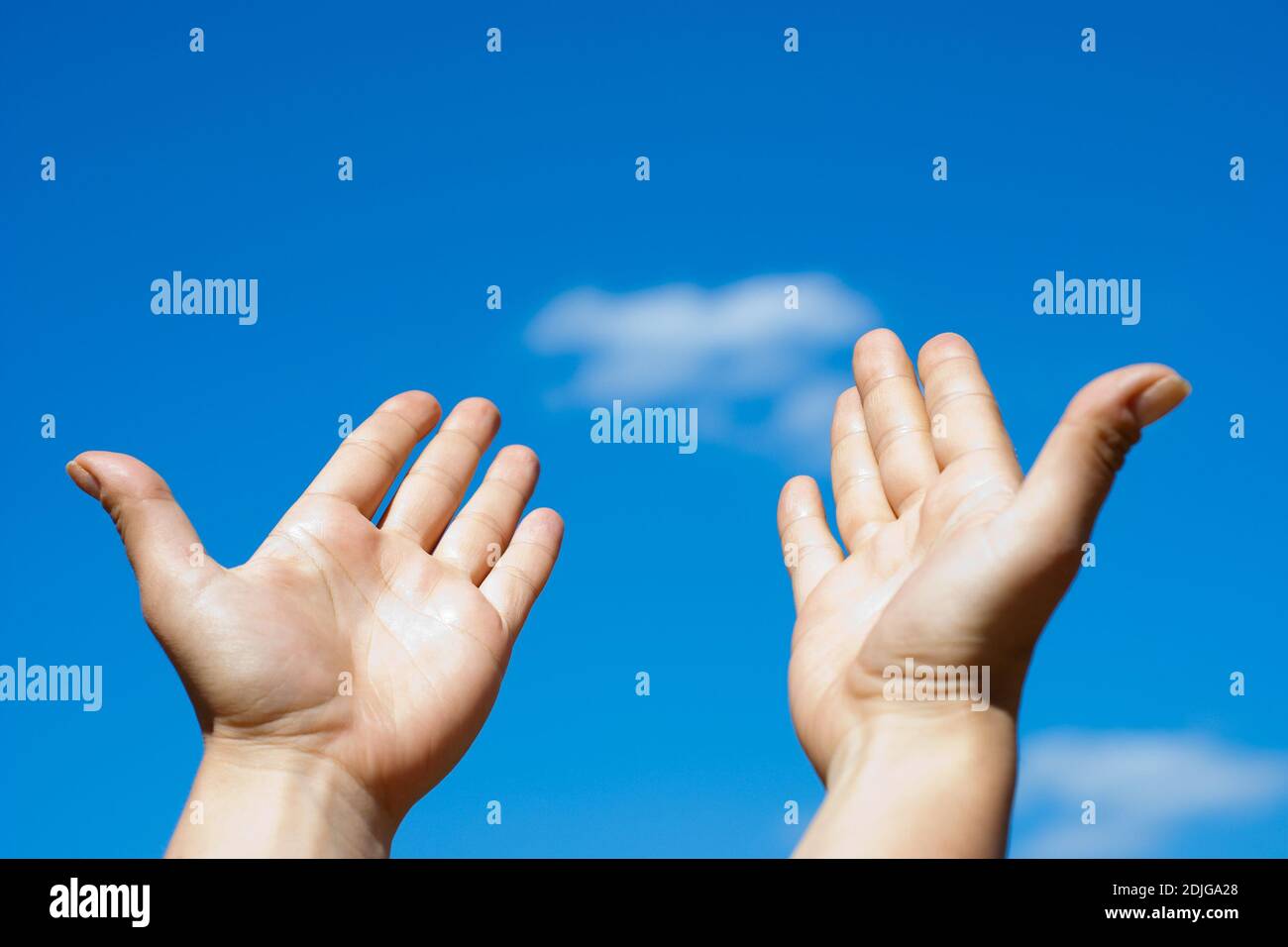Two hand sky hi-res stock photography and images - Alamy