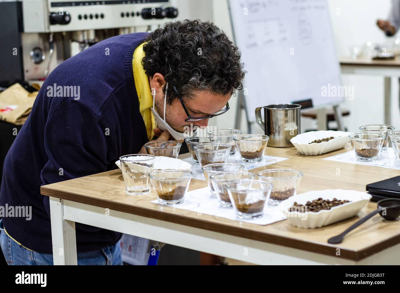 Professional barista testing the smell of a new coffee Stock Photo - Alamy
