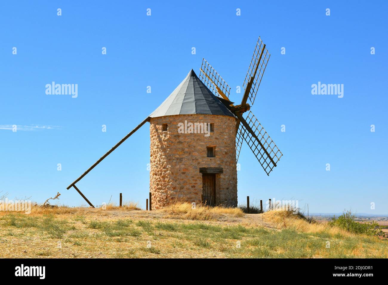 Windmill built in stone and wood in Belmonte. Sunny day, blue sky Stock ...