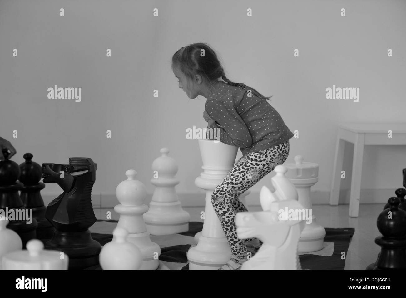 Girl playing chess Black and White Stock Photos & Images - Alamy