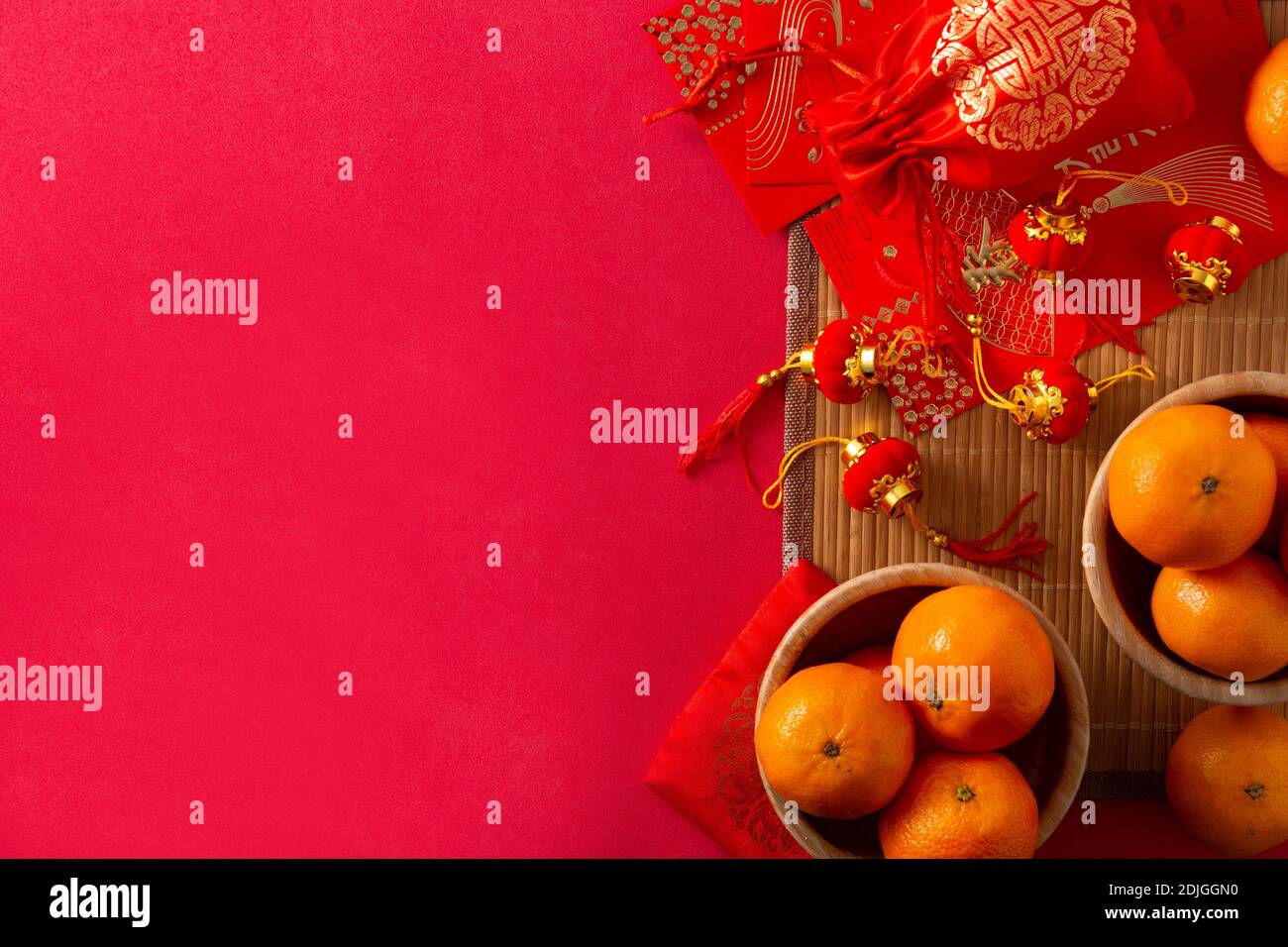 Chinese new year festival decorations and oranges on red background ...