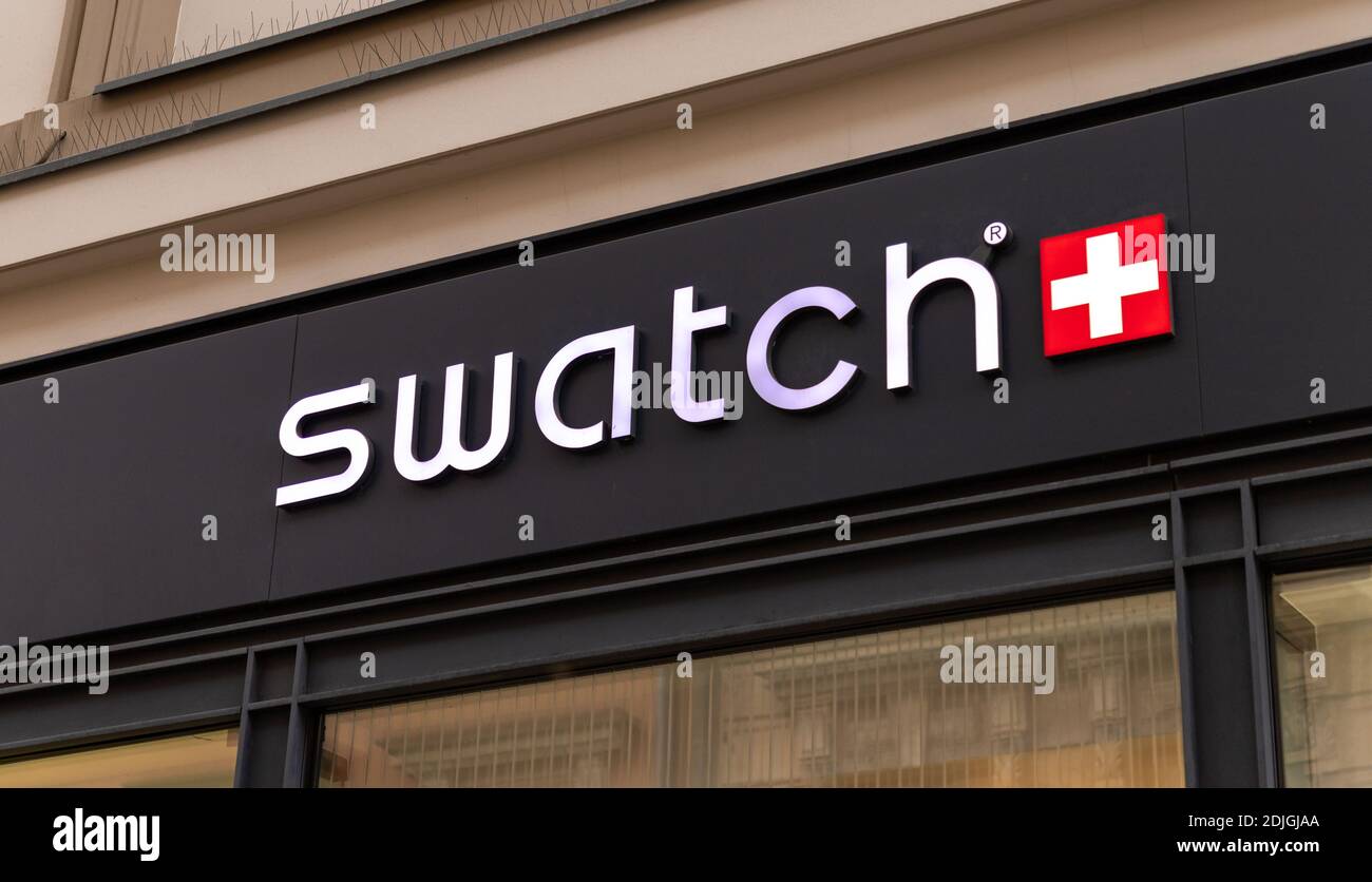 A picture of the Swatch logo on display above a store Stock Photo - Alamy