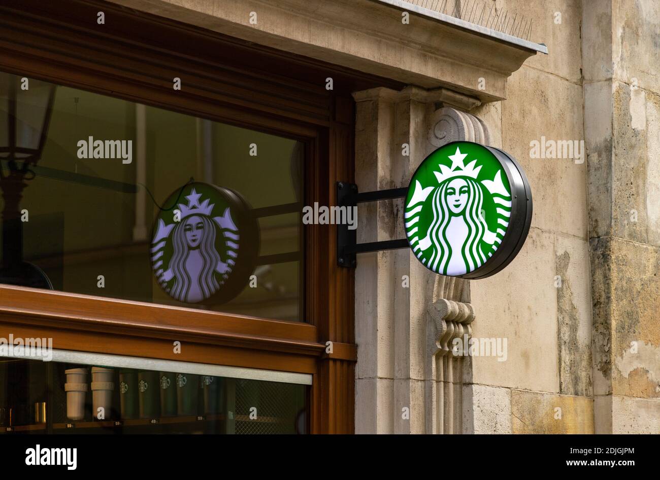 A picture of the Starbucks logo on display in front of one of the ...